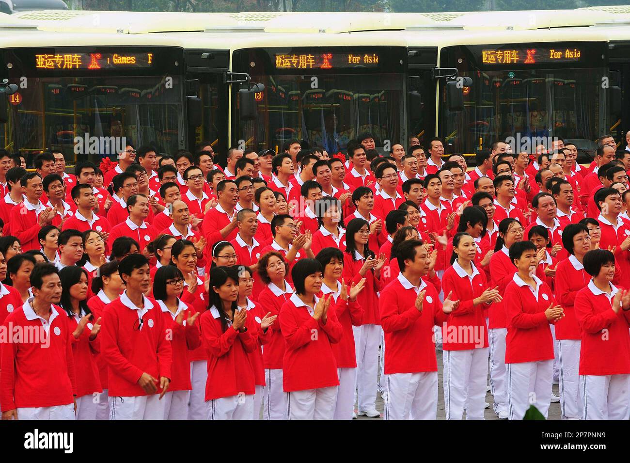 Bus drivers in new uniforms stand in front of the new special buses for ...