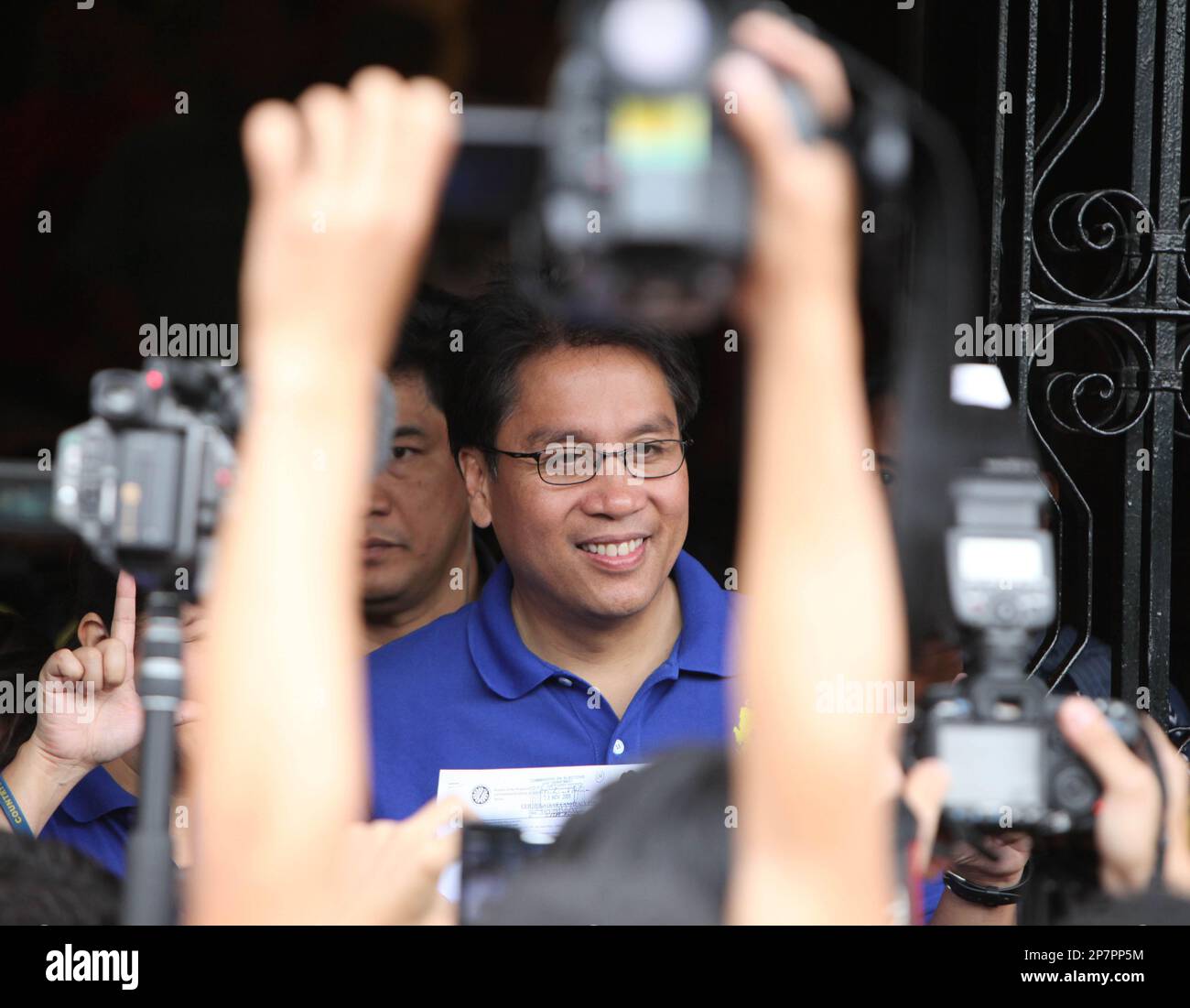 Vice-Presidential candidate Sen. Manuel "Mar" Roxas II emerges from the ...