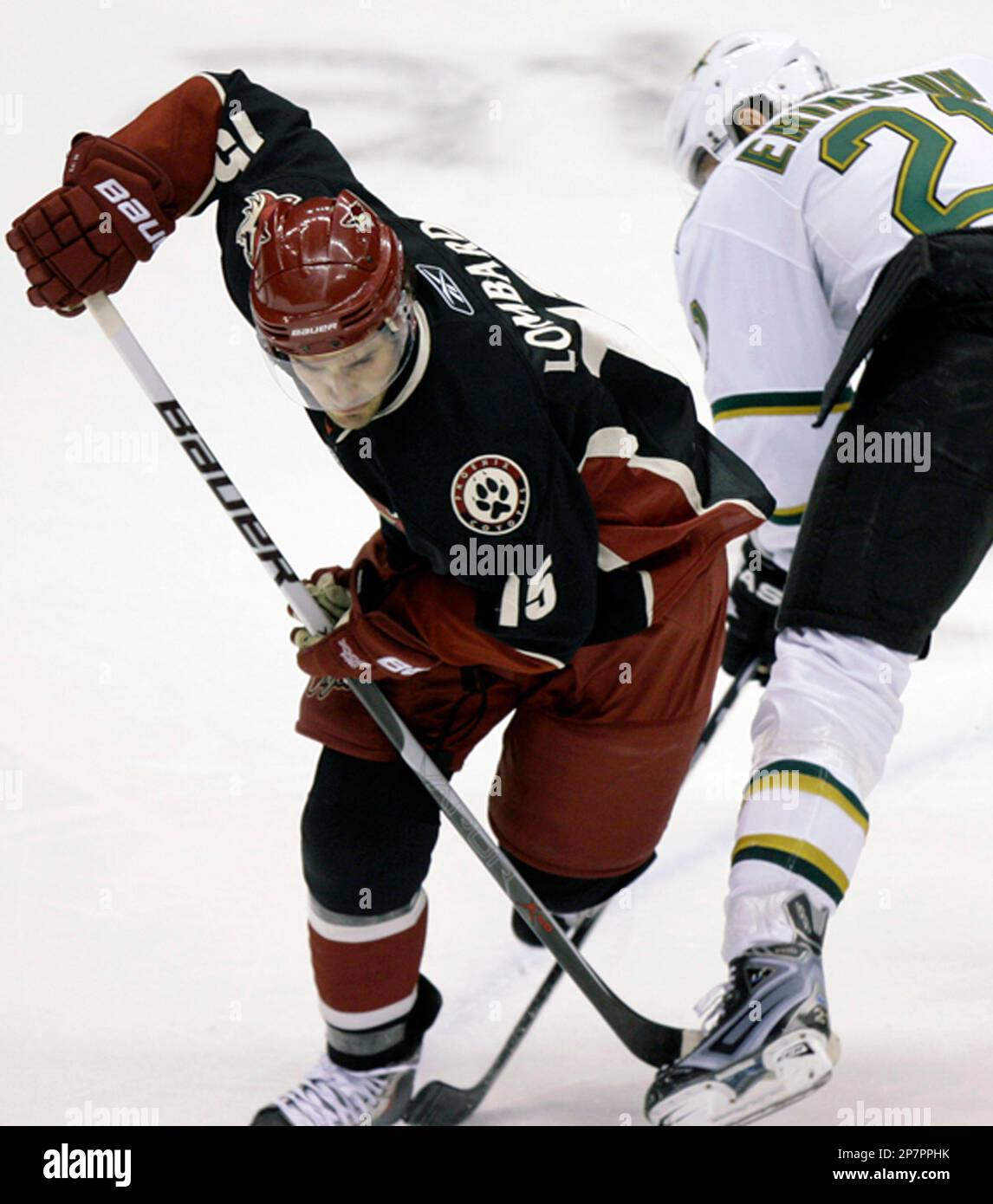 Phoenix Coyotes center Matthew Lombardi, left, checks Dallas Stars left ...