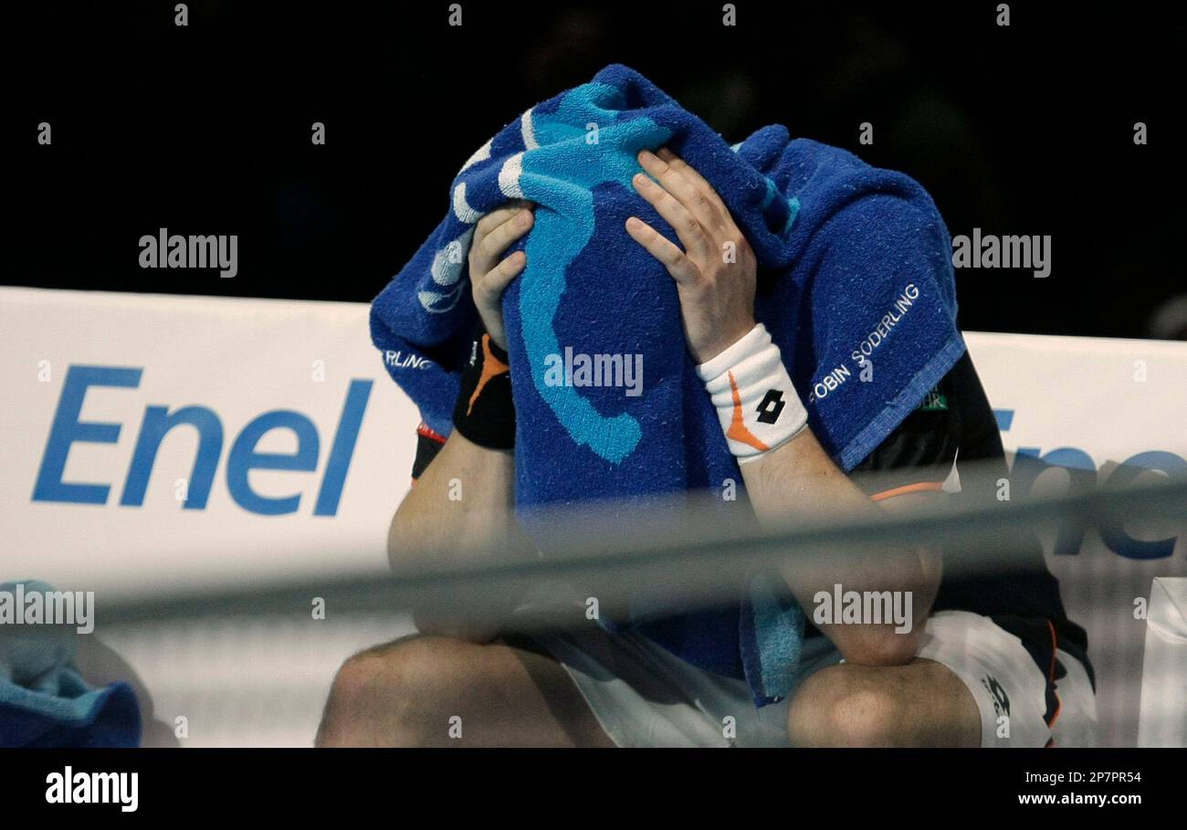 Sweden's Robin Soderling rests between games as he plays Nikolay ...