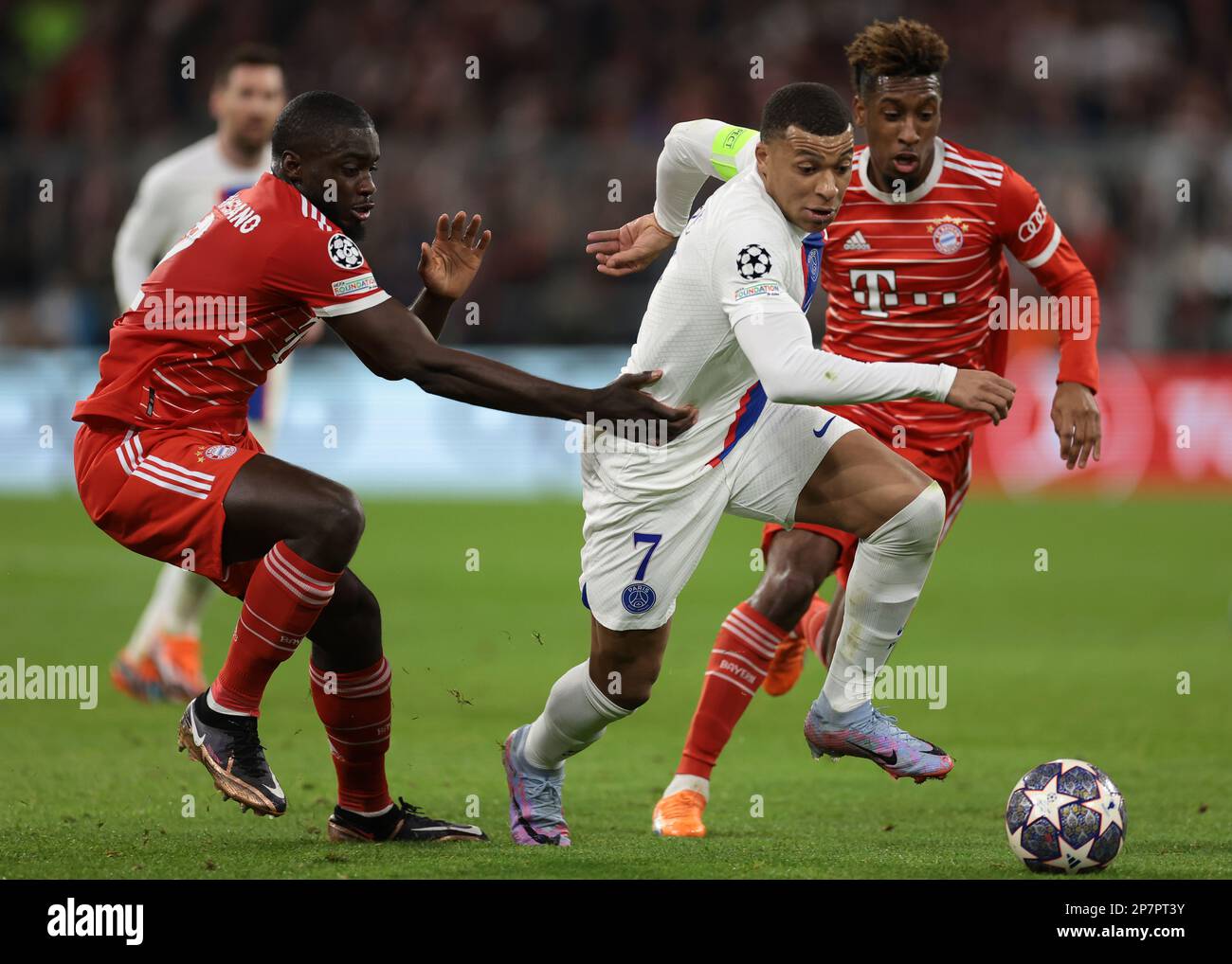 Munich, Germany. 8th Mar, 2023. Kylian Mbappe of PSG takes on Dayot ...