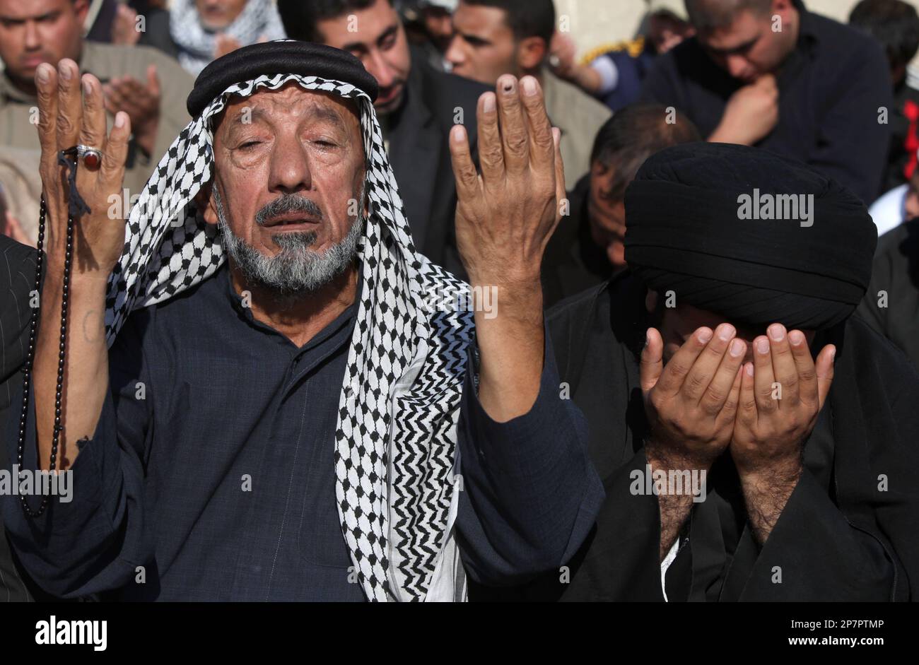 Iraqi worshippers pray during Friday prayers in the Shiite stronghold ...