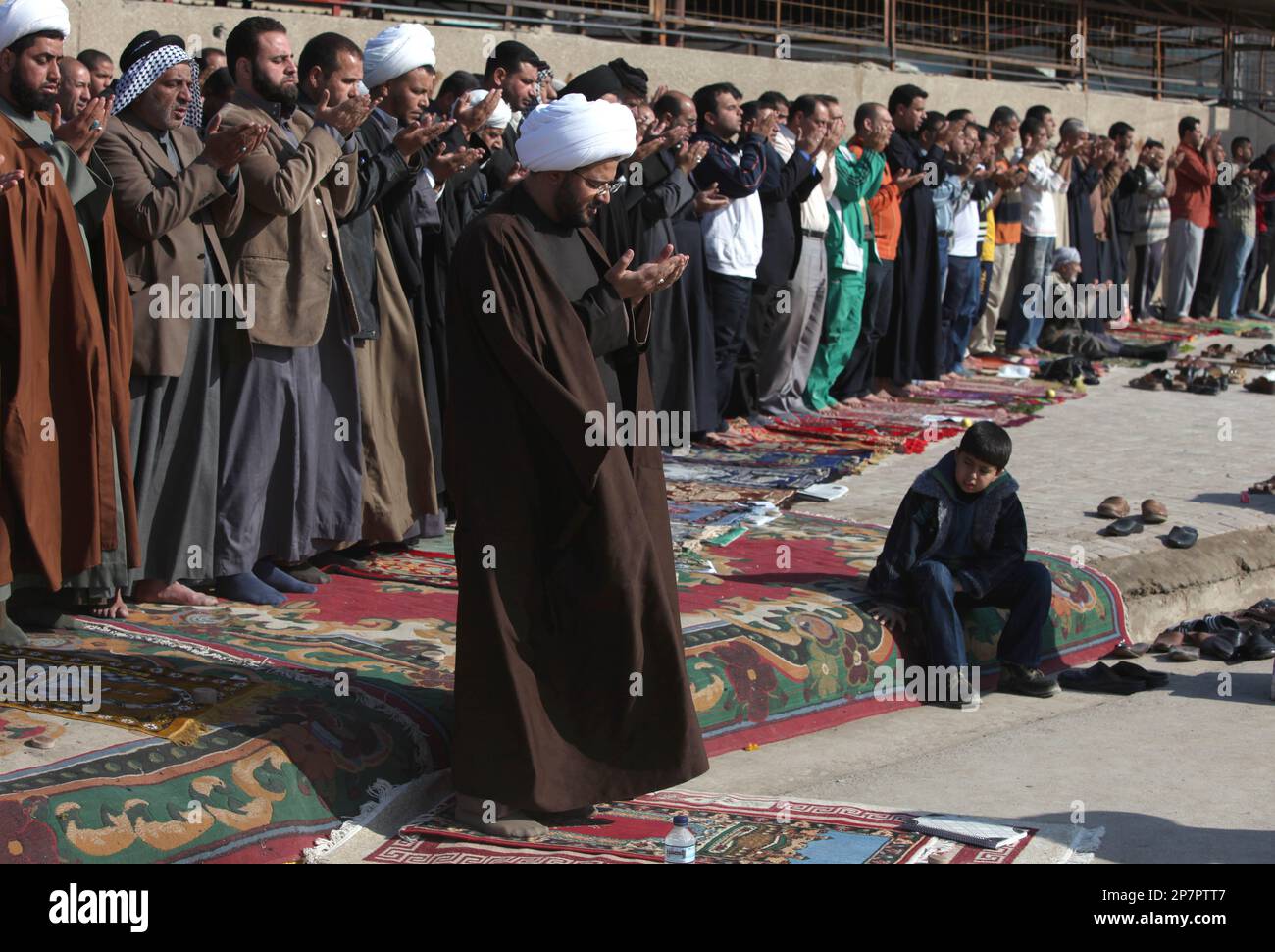 Iraqi worshippers pray during Friday prayers in the Shiite stronghold ...
