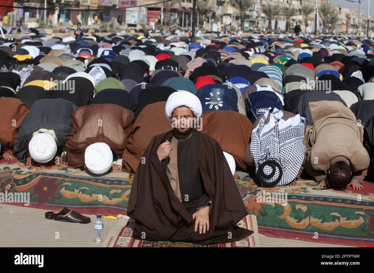 Iraqi worshippers pray during Friday prayers in the Shiite stronghold ...