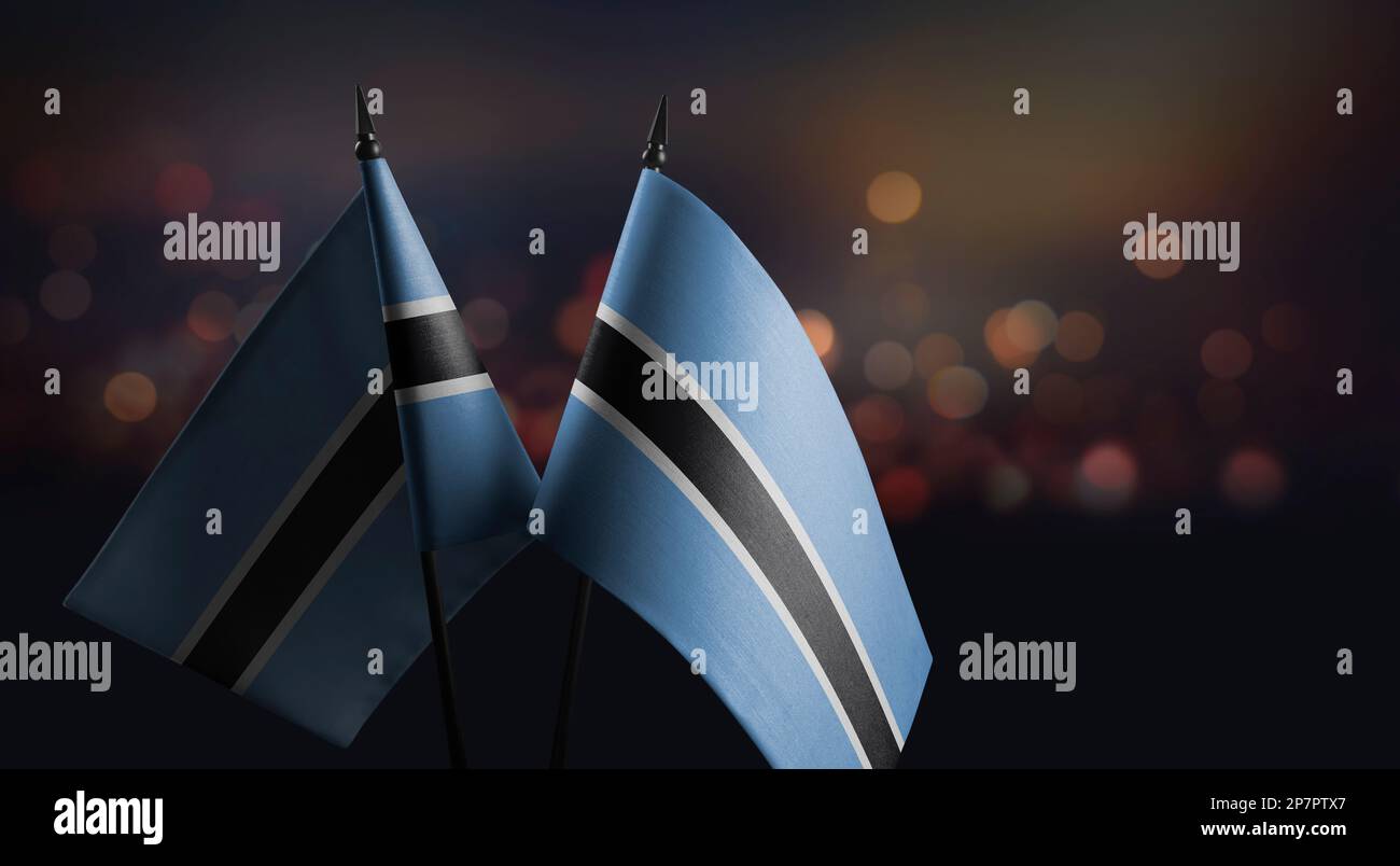 Small flags of the Botswana on an abstract blurry background Stock ...