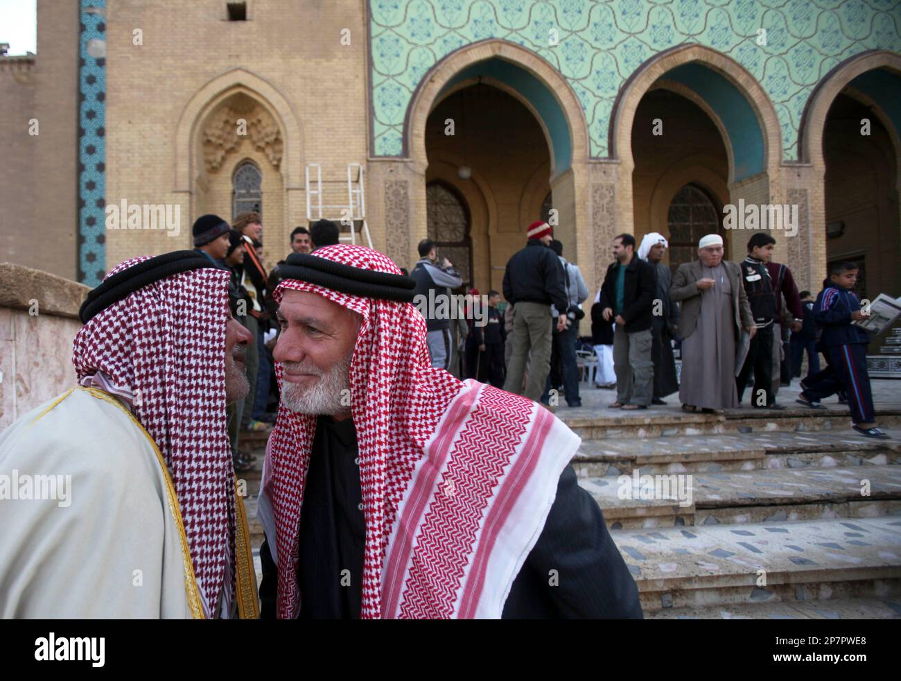 Iraqi Sunni Muslims exchange greetings after Eid al-Adha prayers ...