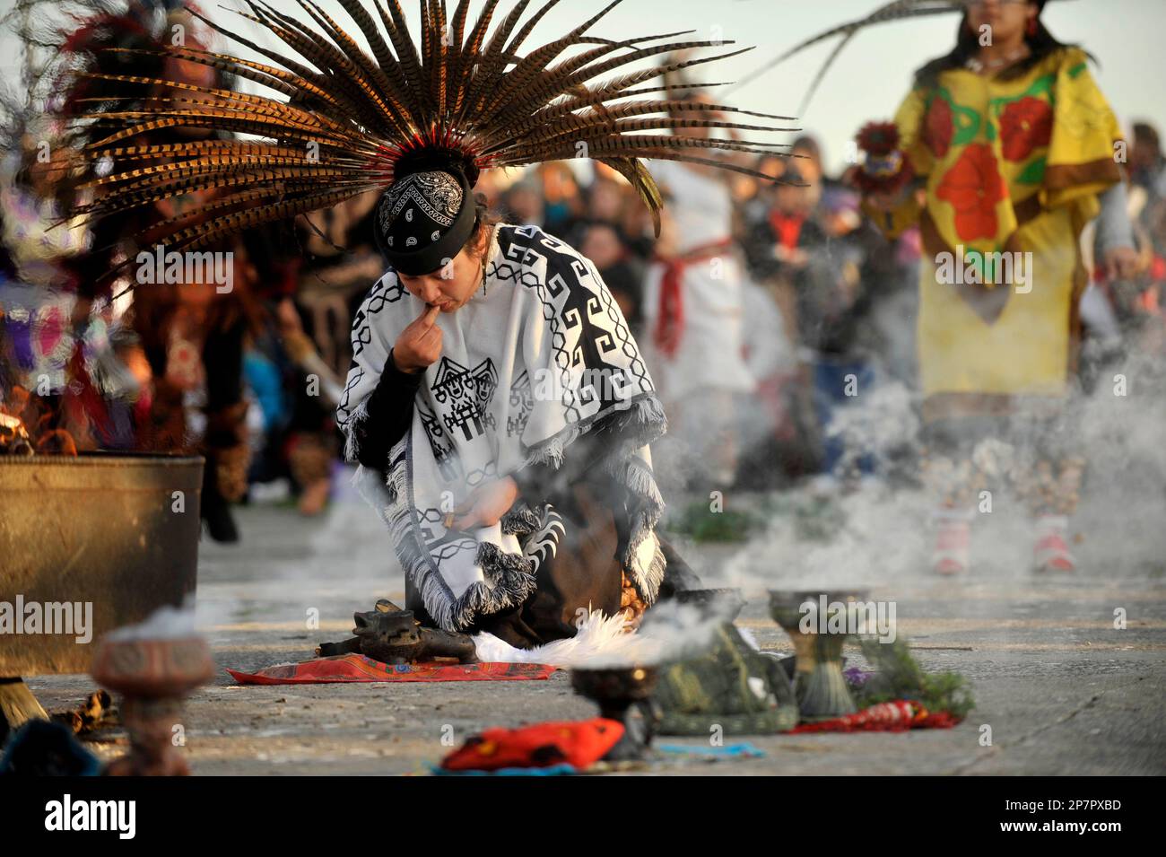 An woman prepares an alter during an Aztec ceremony at The Indigenous ...
