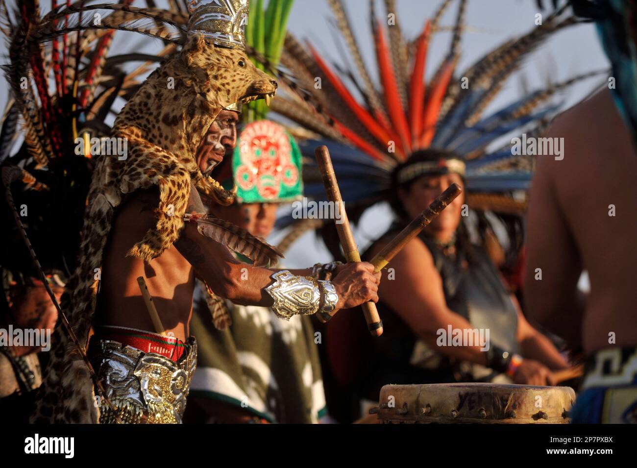 A dancer drums during an Aztec ceremony at The Indigenous People’s ...