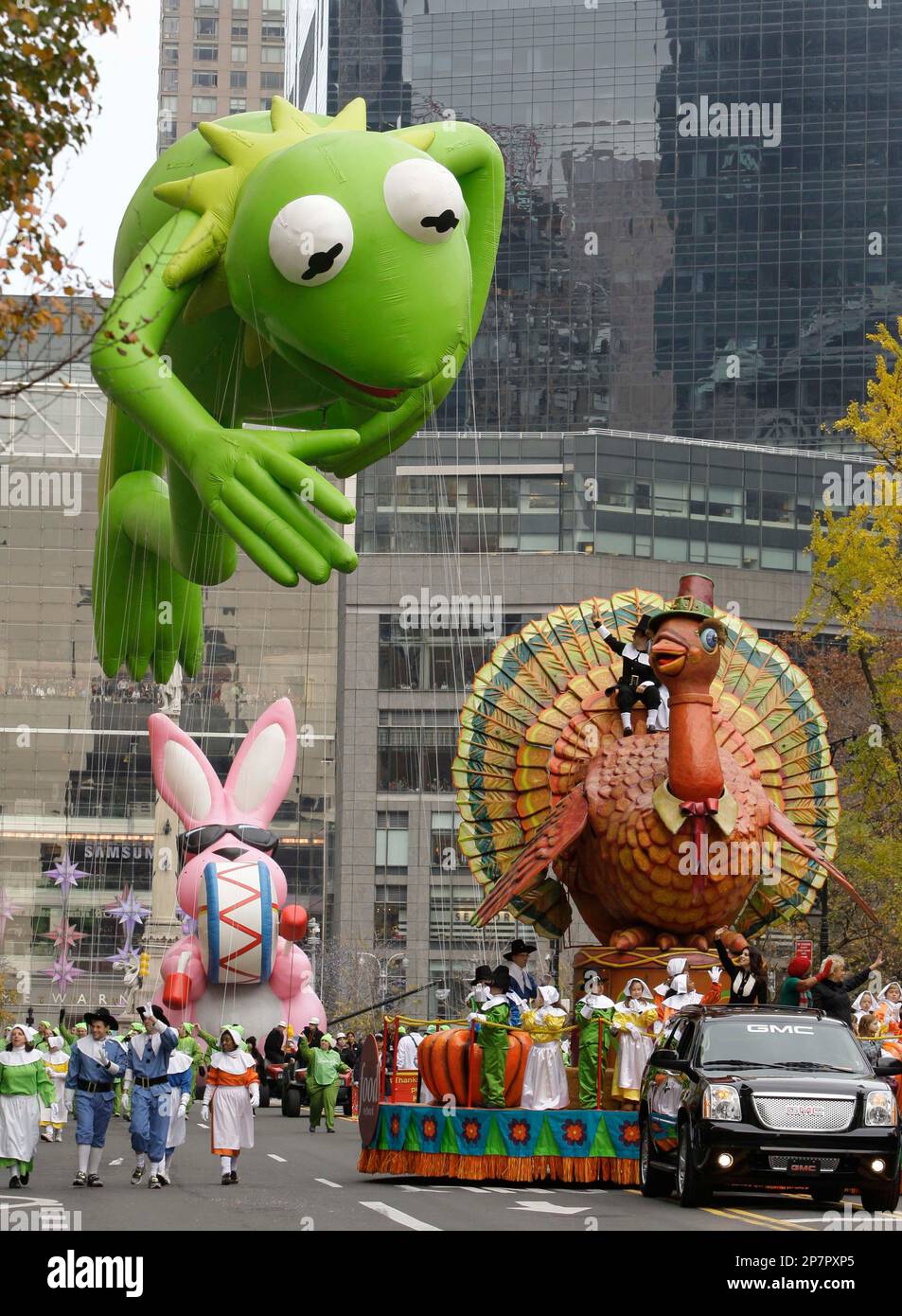 The Kermit the Frog and the Energizer Bunny floats are guided across ...