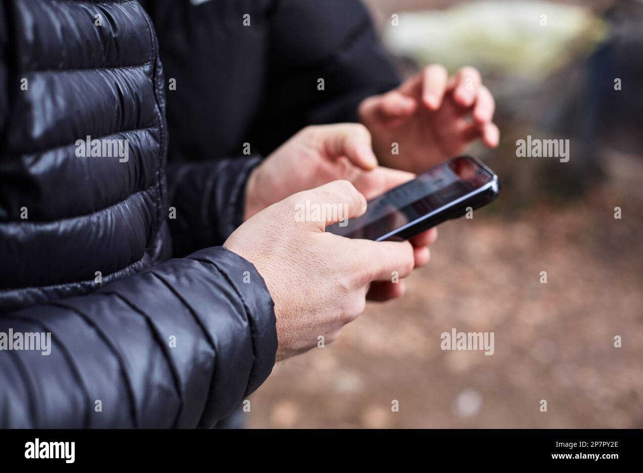 Male hands using mobile phone Stock Photo - Alamy