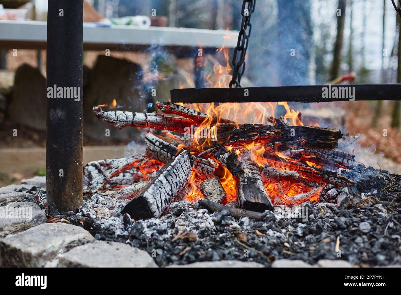 Barbecue grill with camp fire Stock Photo - Alamy