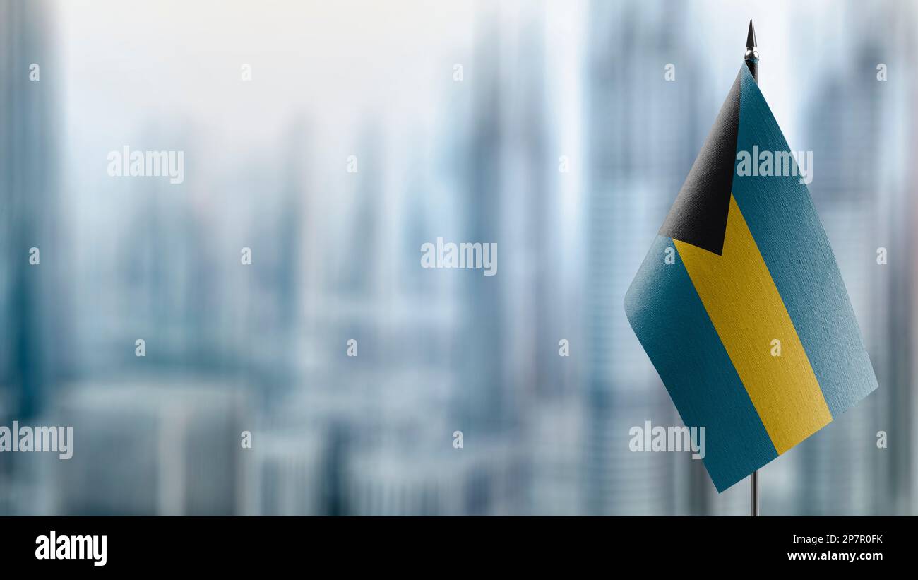 Small flags of the Bahamas on an abstract blurry background Stock Photo ...