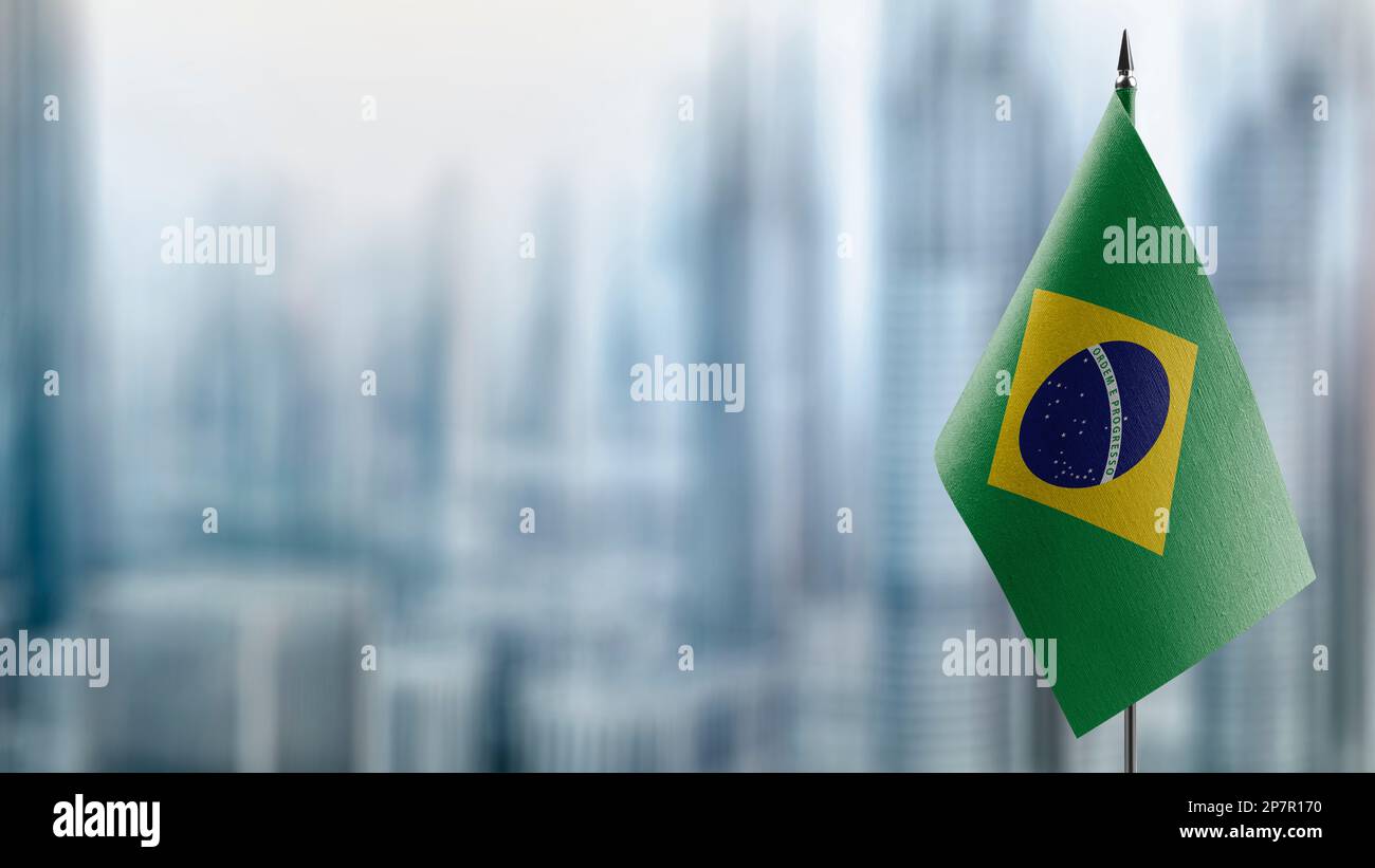 Small flags of the Brazil on an abstract blurry background Stock Photo ...