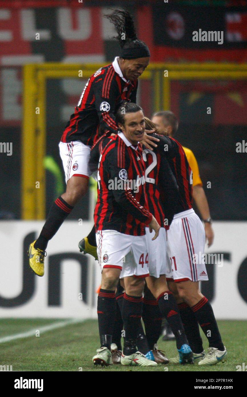 AC Milan forward Marco Borriello, unseen in the picture, celebrates ...