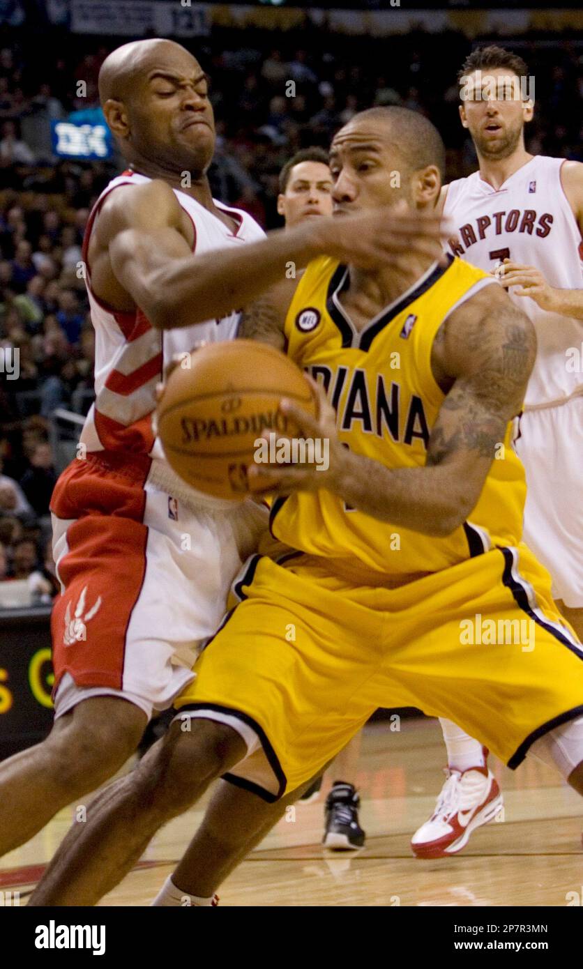 Toronto Raptors' Jarrett Jack tussles with Indiana Pacers' Dahntay ...