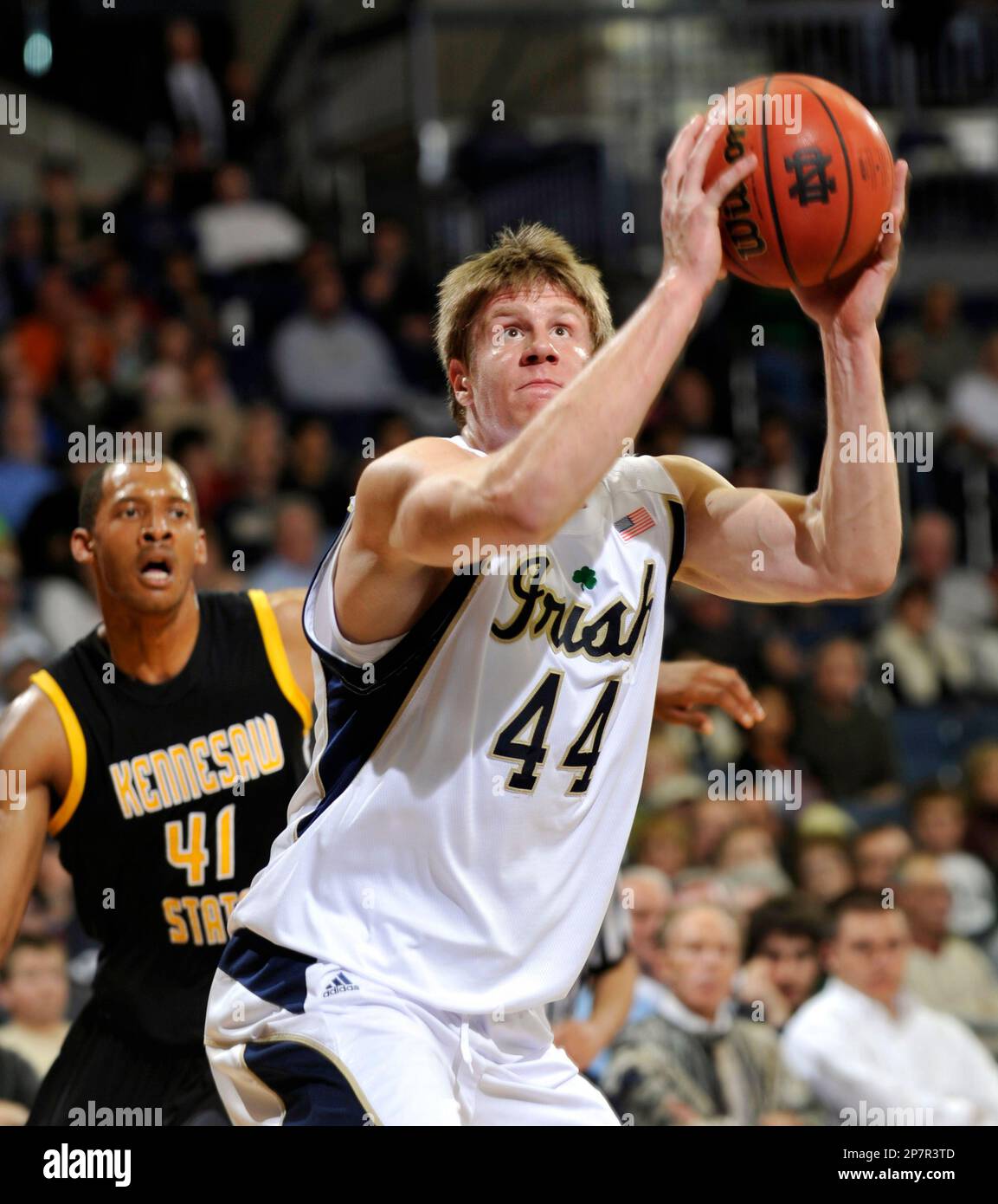Notre Dame forward Luke Harangody, right, puts up a shot as Kennesaw ...