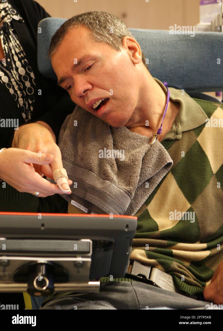 Belgium's Rom Houben uses his touchscreen to communicate during an ...