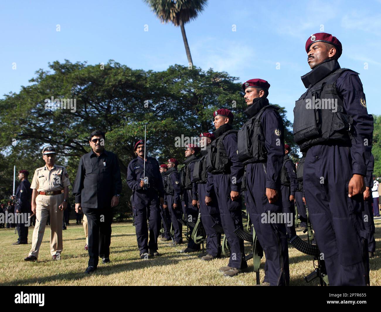 Maharashtra’s Chief Minister Ashok Chavan, center,inspects the ...
