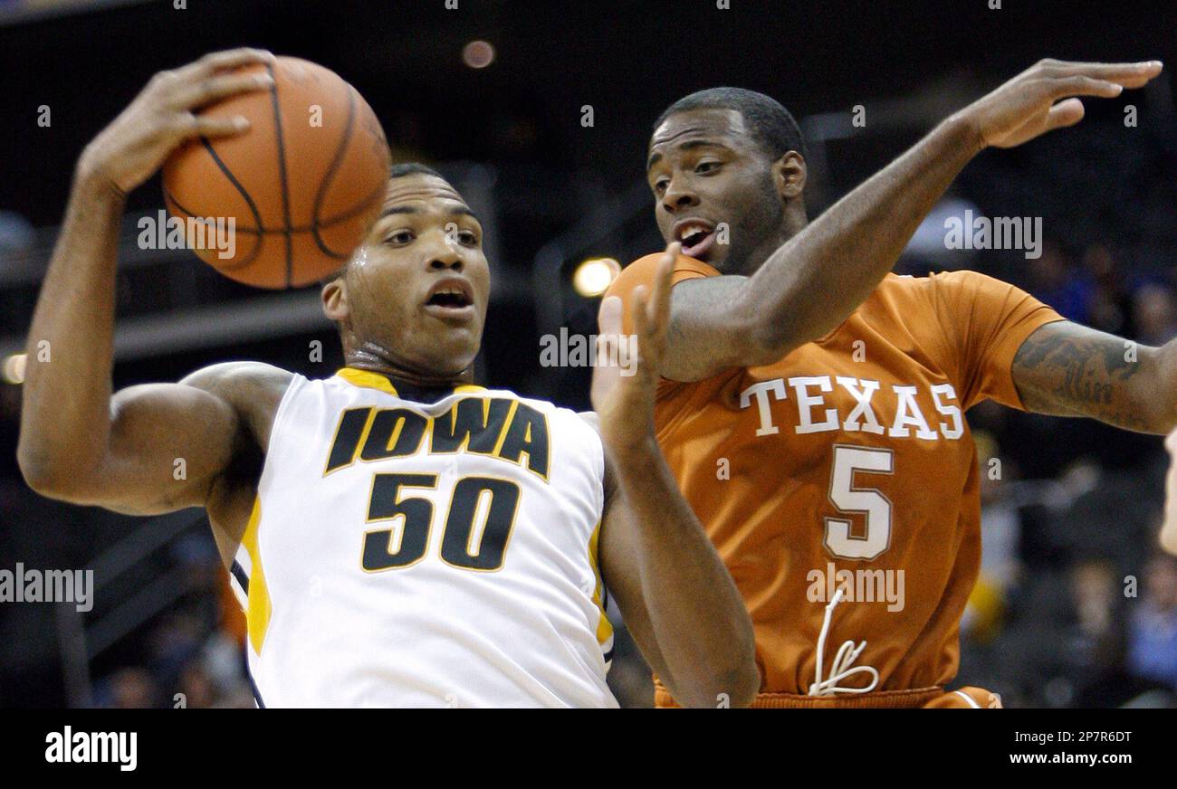 Iowa's Jarryd Cole (50) beats Texas' Damion James (5) to a rebound ...