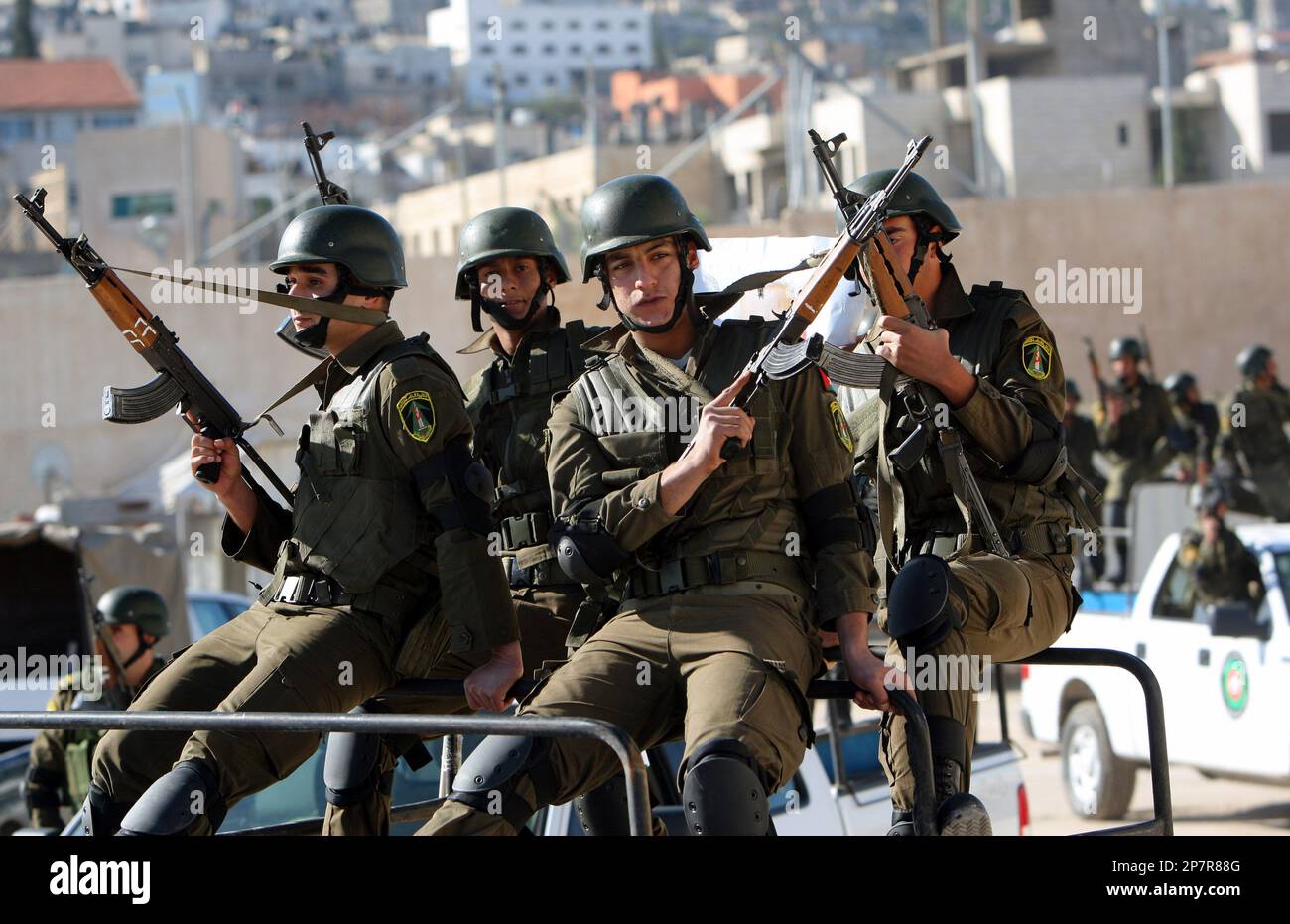 Palestinian security force officers take part in a parade supporting ...