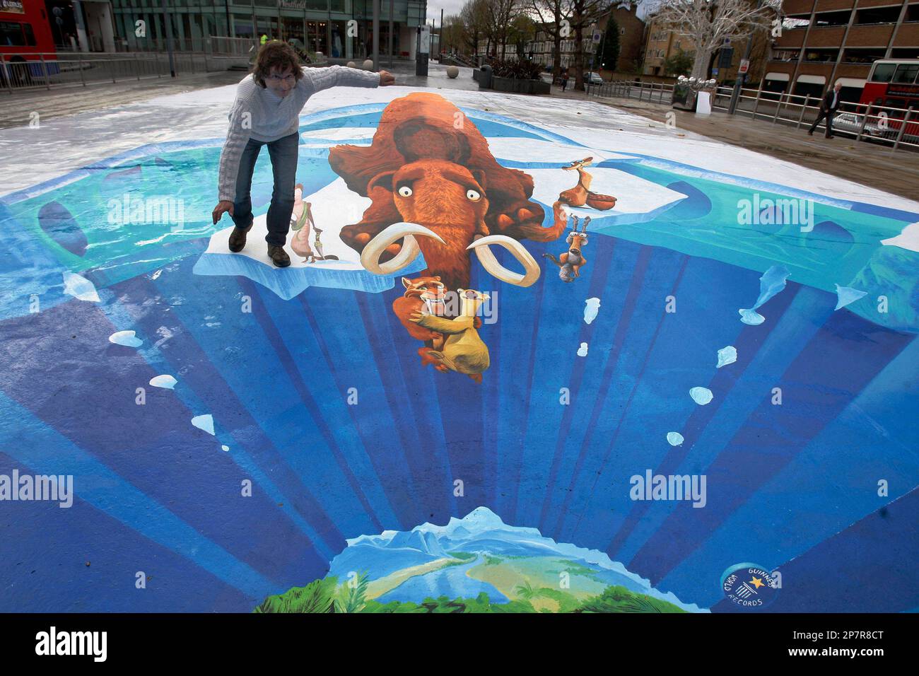 German pavement artist Edgar Mueller poses with his anamorphic pavement ...