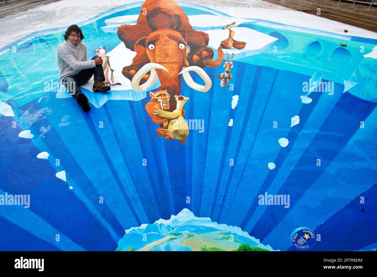 German pavement artist Edgar Mueller poses with his anamorphic pavement ...