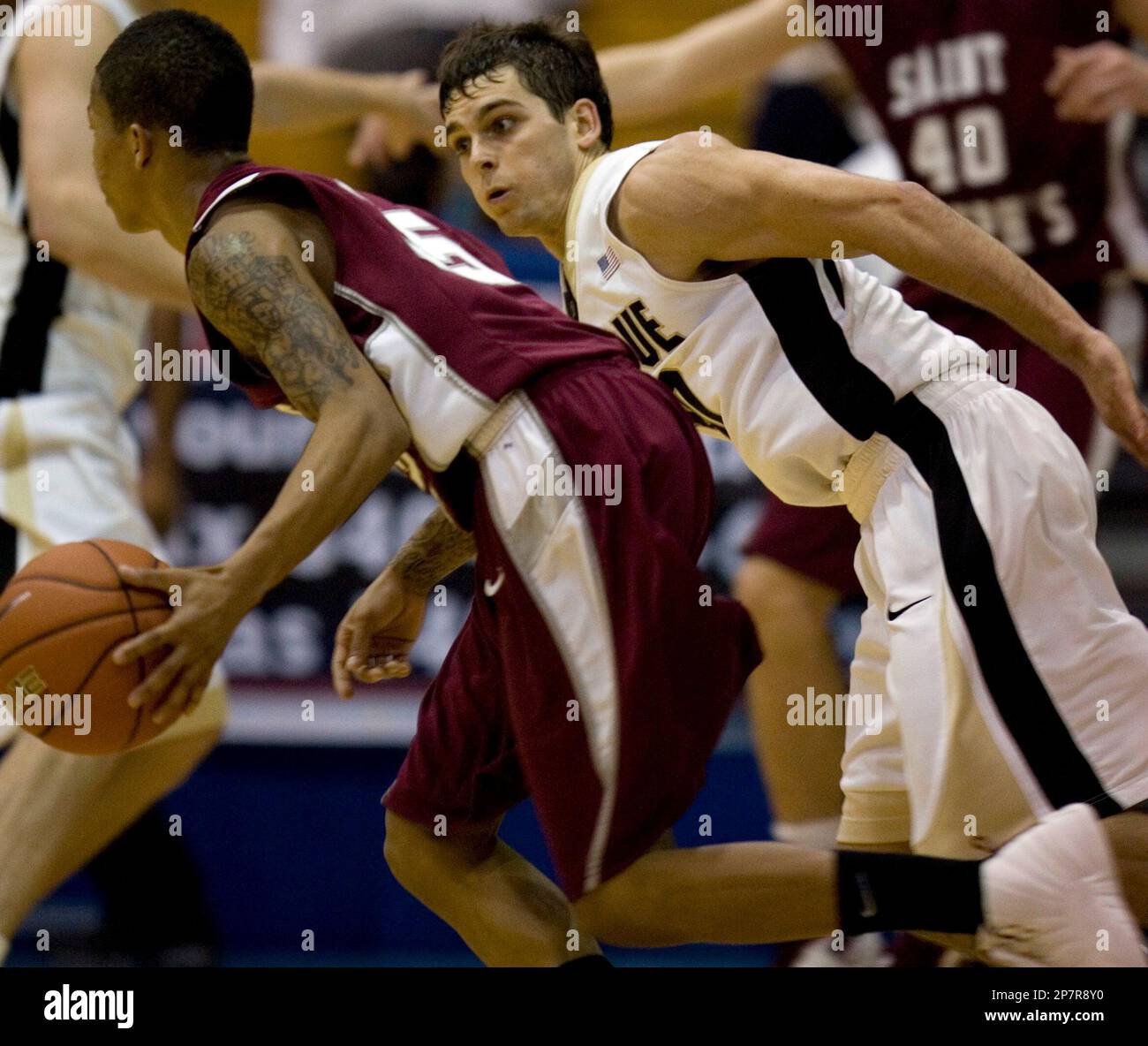 Purdue's Mark Wohlford, right, chases Saint Joseph's Carl Jones during ...