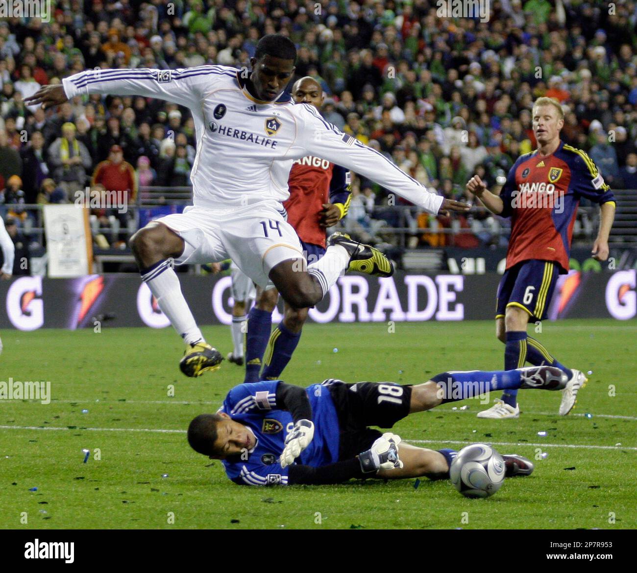Los Angeles Galaxy's Edson Buddle leaps over Real Salt Lake goalkeeper ...