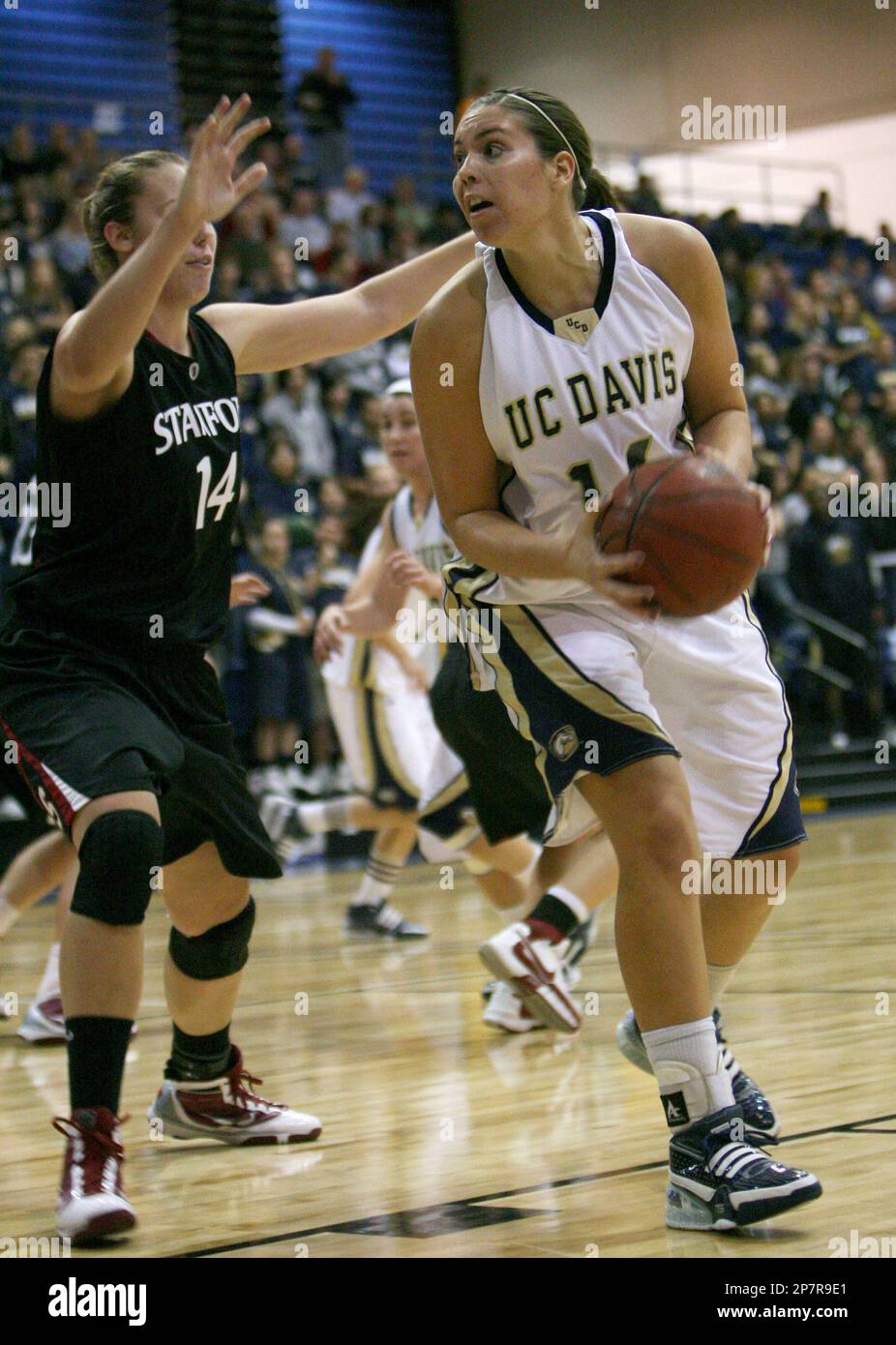 UC Davis forward Lisa Peterson, right, drives against Stanford defender ...