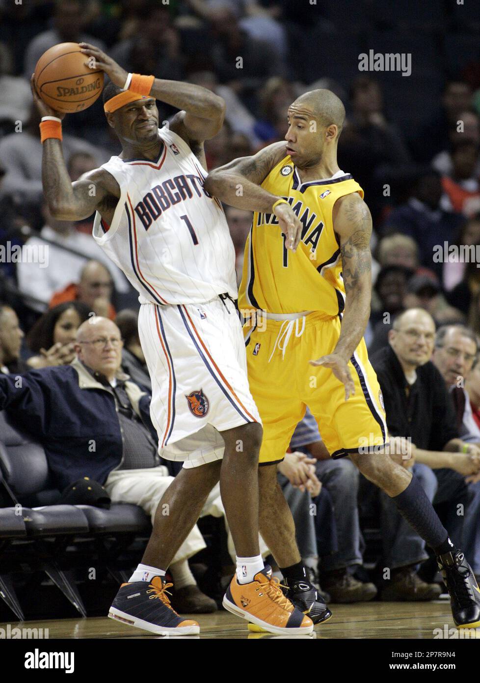 Indiana Pacers guard Dahntay Jones, right, fouls Charlotte Bobcats ...