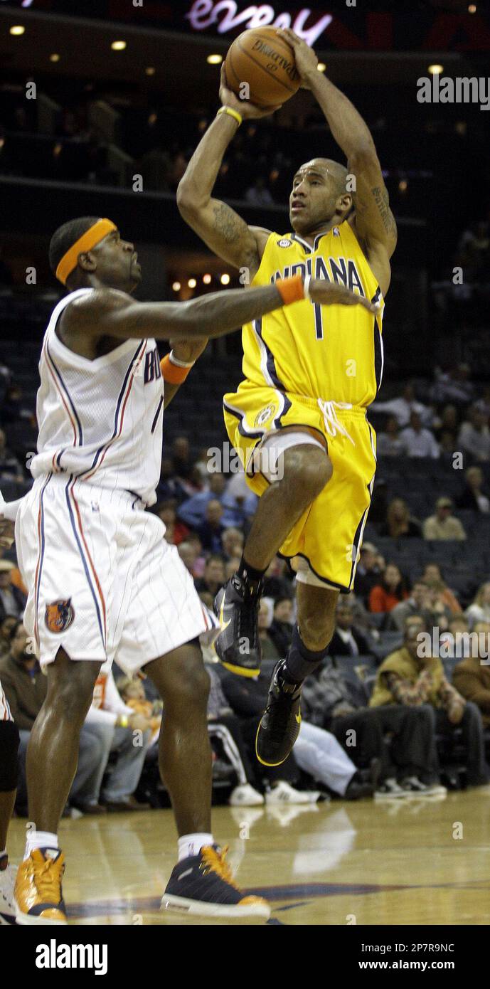 Indiana Pacers guard Dahntay Jones, right, shoots over Charlotte ...