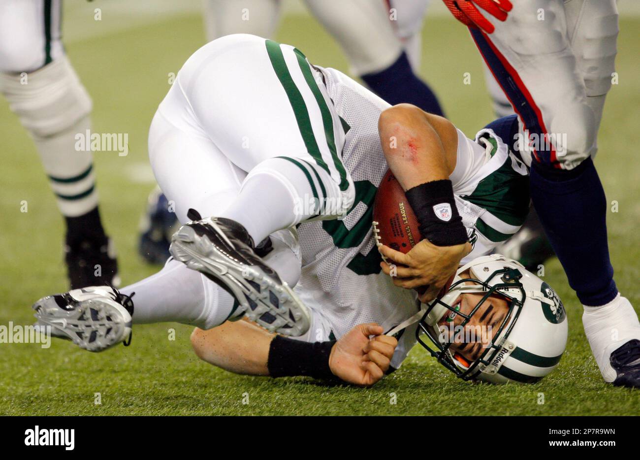 New York Jets quarterback Mark Sanchez (6) lands on the turf after ...
