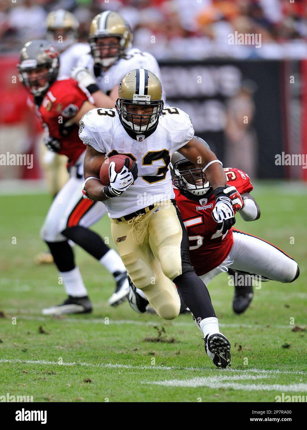 New Orleans Saints running back Pierre Thomas (23) breaks a tackle from ...
