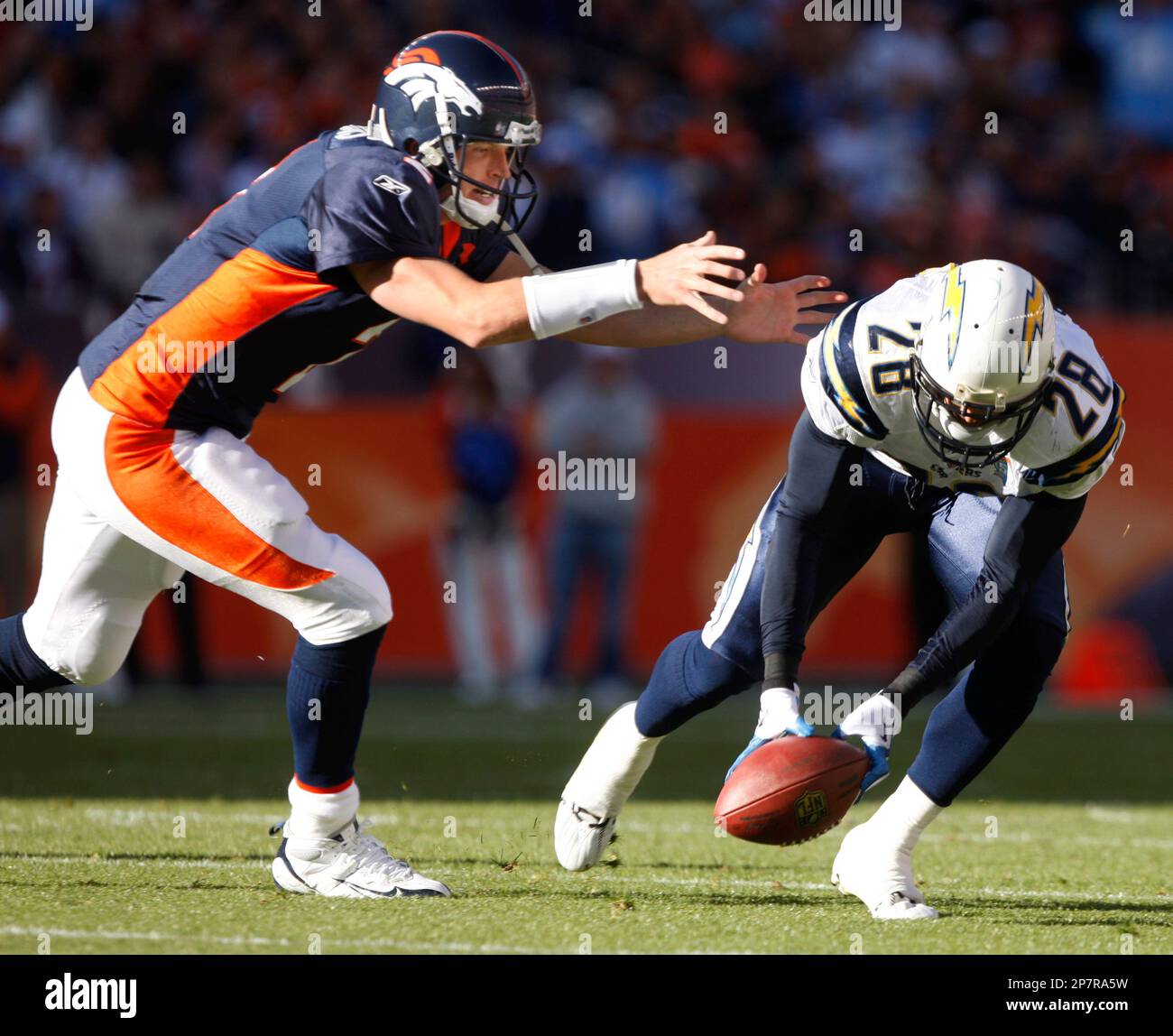Denver Broncos quarterback Chris Simms, left, tries to catch San Diego ...