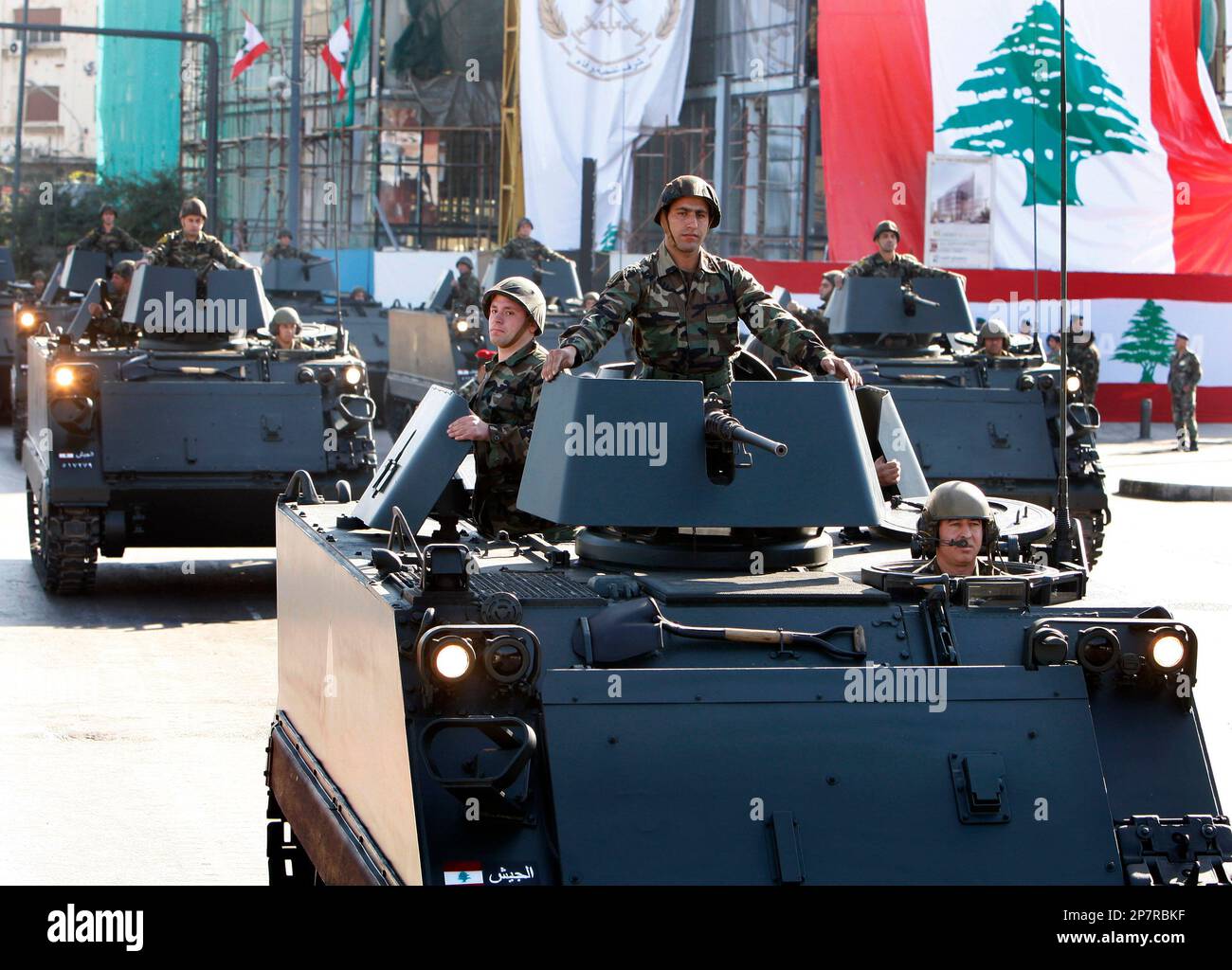 Lebanese soldiers sit atop of their armored personnel carriers during a ...