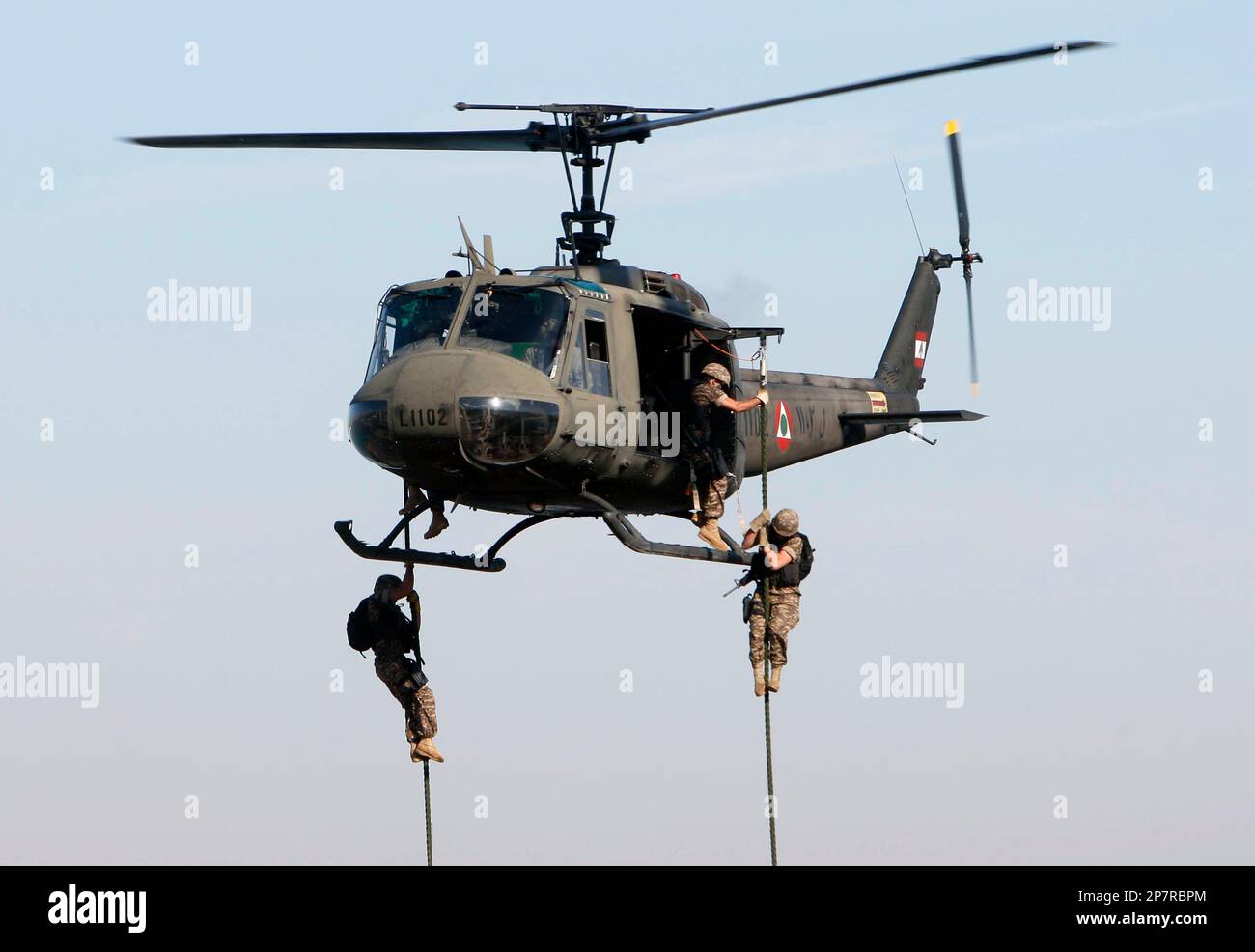 Lebanese special forces soldiers descend from a helicopter during a ...