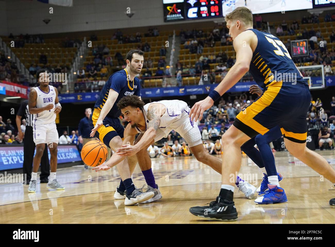 Furman forward Jalen Slawson (20) scrambles for a loose ball between ...