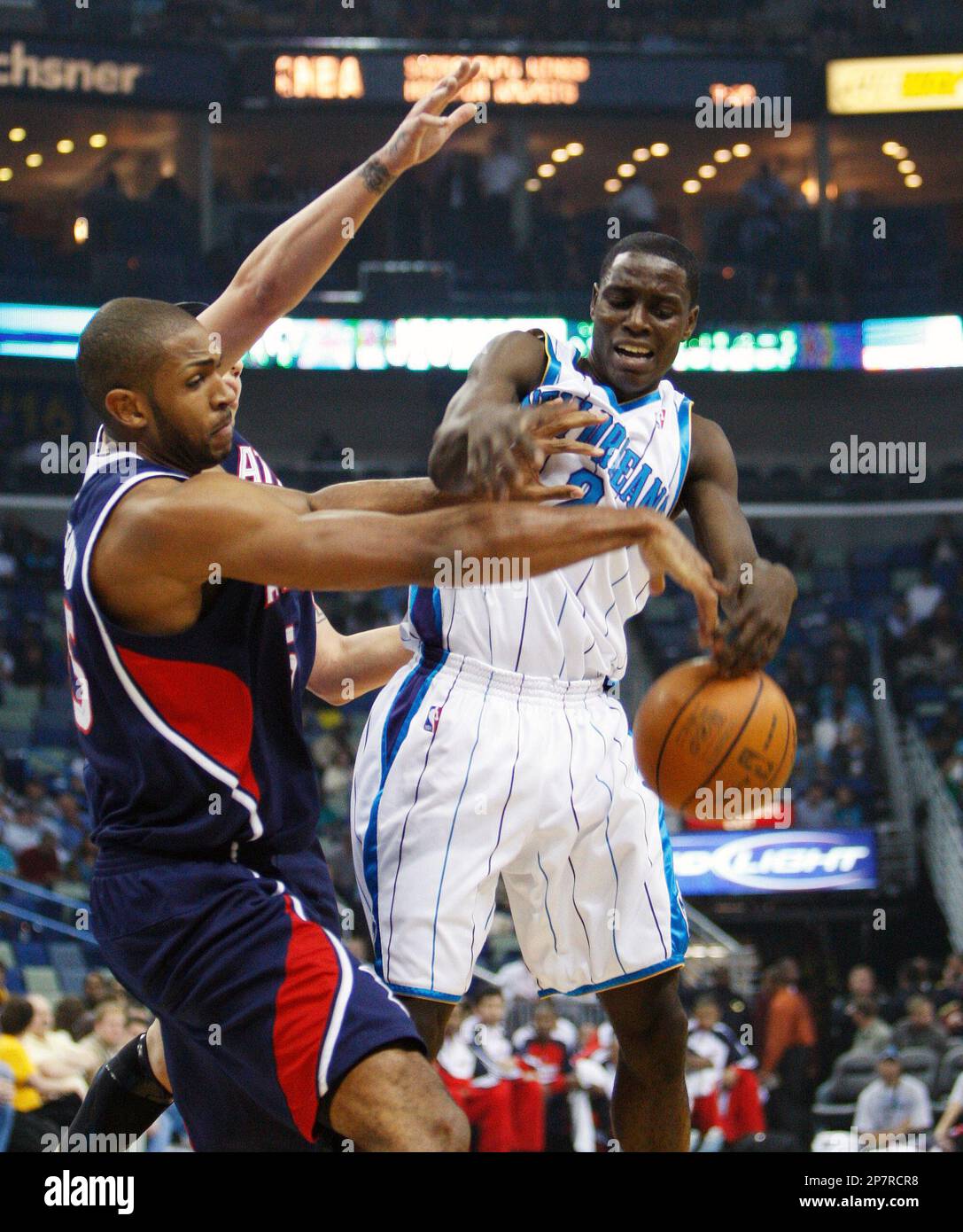 Atlanta Hawks center Al Horford, left, reaches for the ball in front of ...