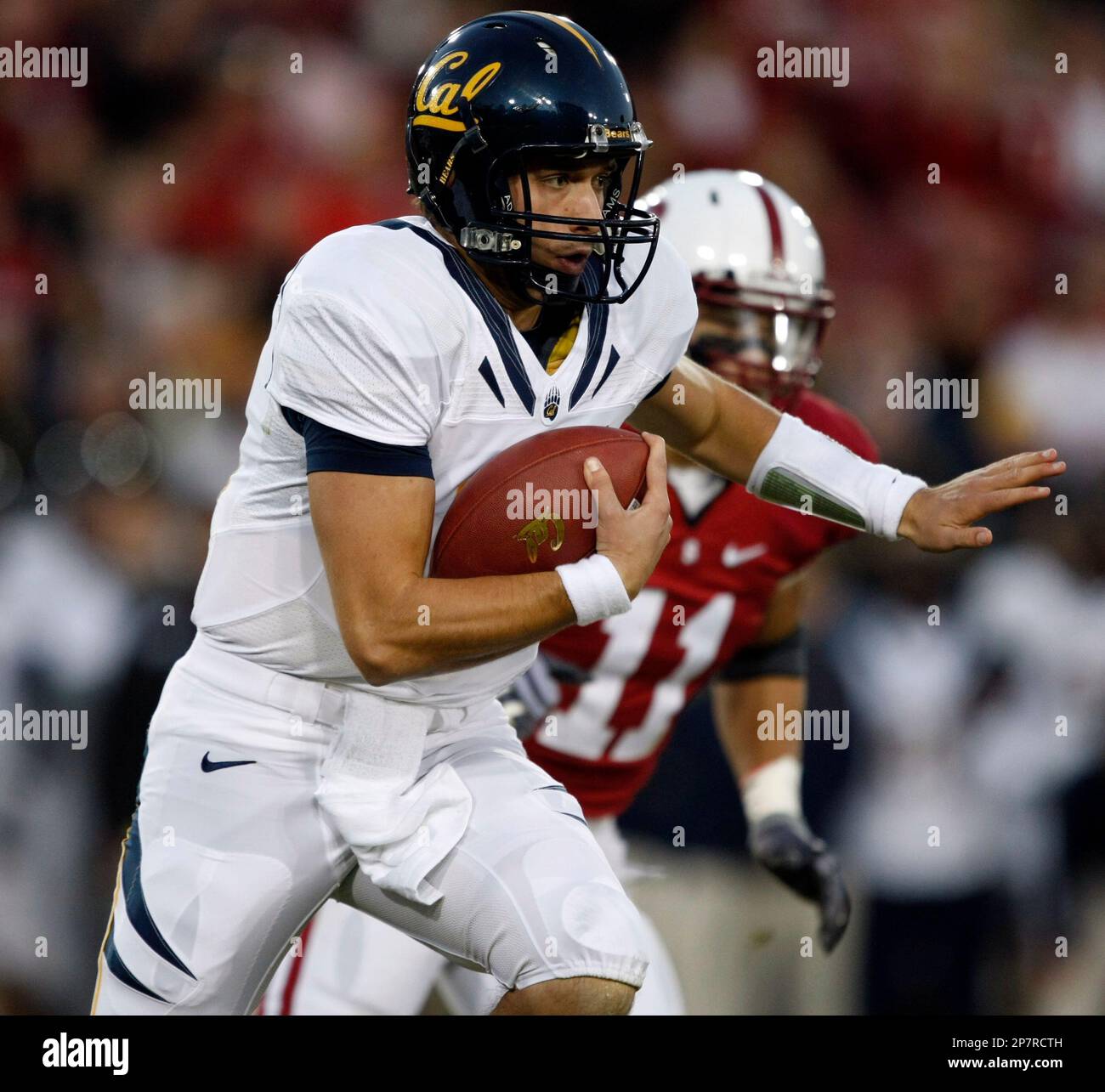 California quarterback Kevin Riley runs out of the pocket during the ...