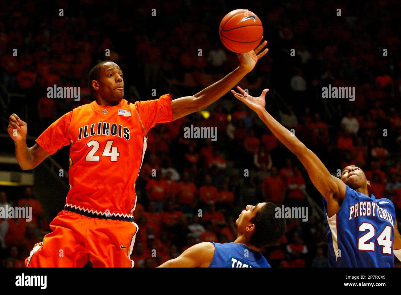 Illinois' Mike Davis (24) reaches out for a rebound against Presbyterian's Khalid Mutakabbir (24 ...