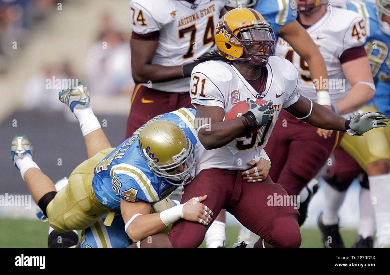 Arizona State's Dimitri Nance (31) is tackled by UCLA linebacker Kyle ...