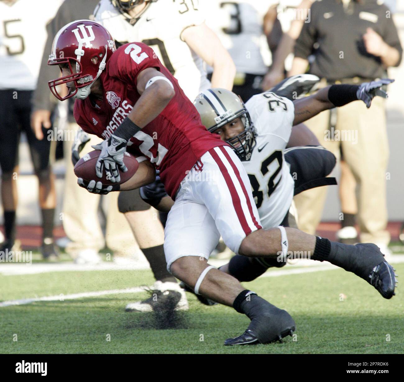 Indiana wide receiver Tandon Doss (2) tries to break away from Purdue ...