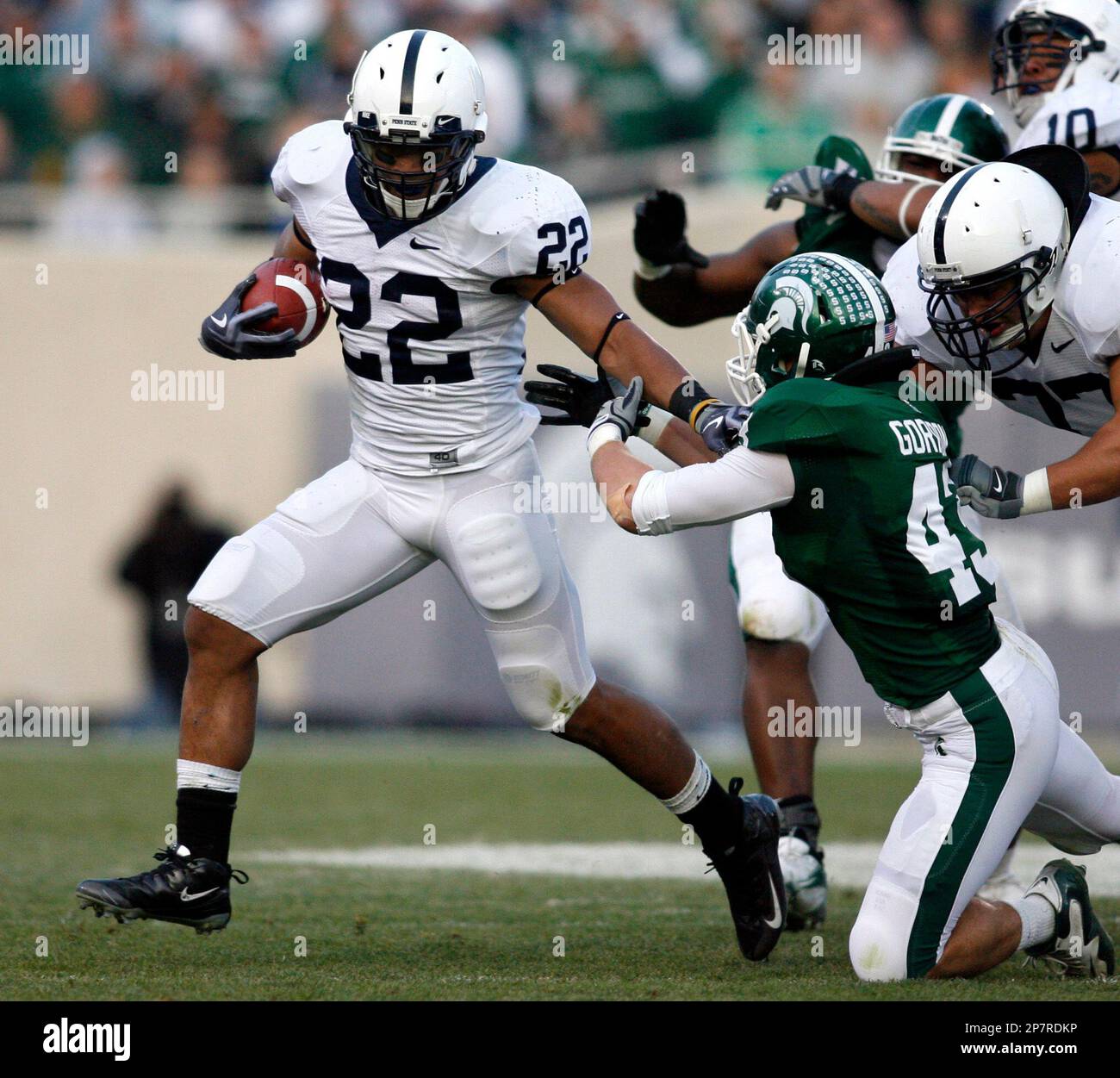 Penn State's Evan Royster (22) rushes against Michigan State's Eric ...