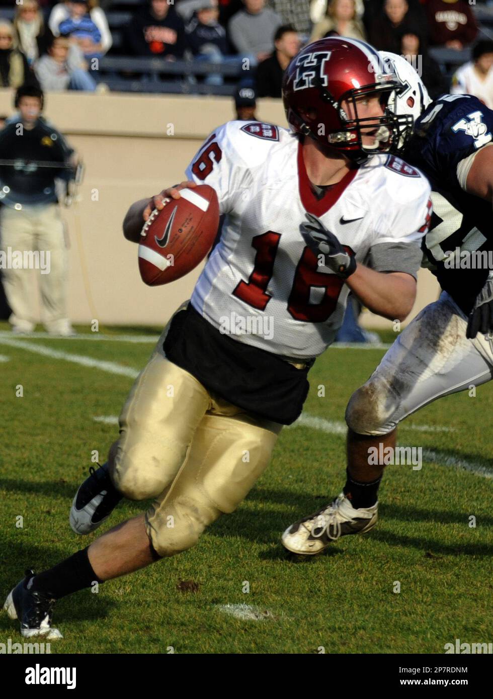 Harvard quarterback Collier Winters rolls out to pass during the second ...