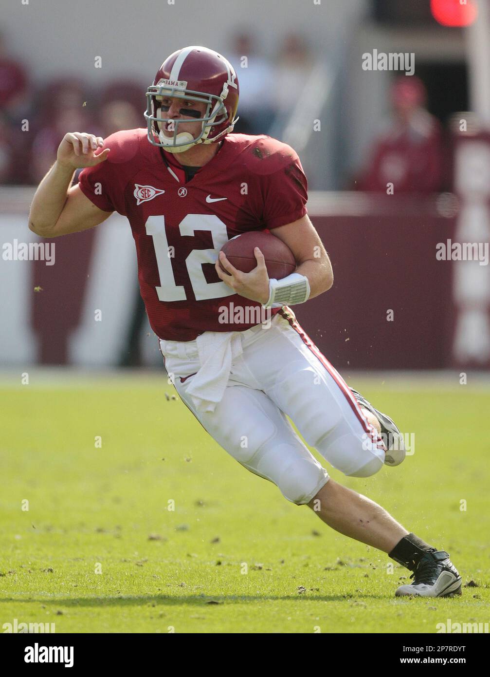 Alabama quarterback Greg McElroy (12) looks for running room in the ...