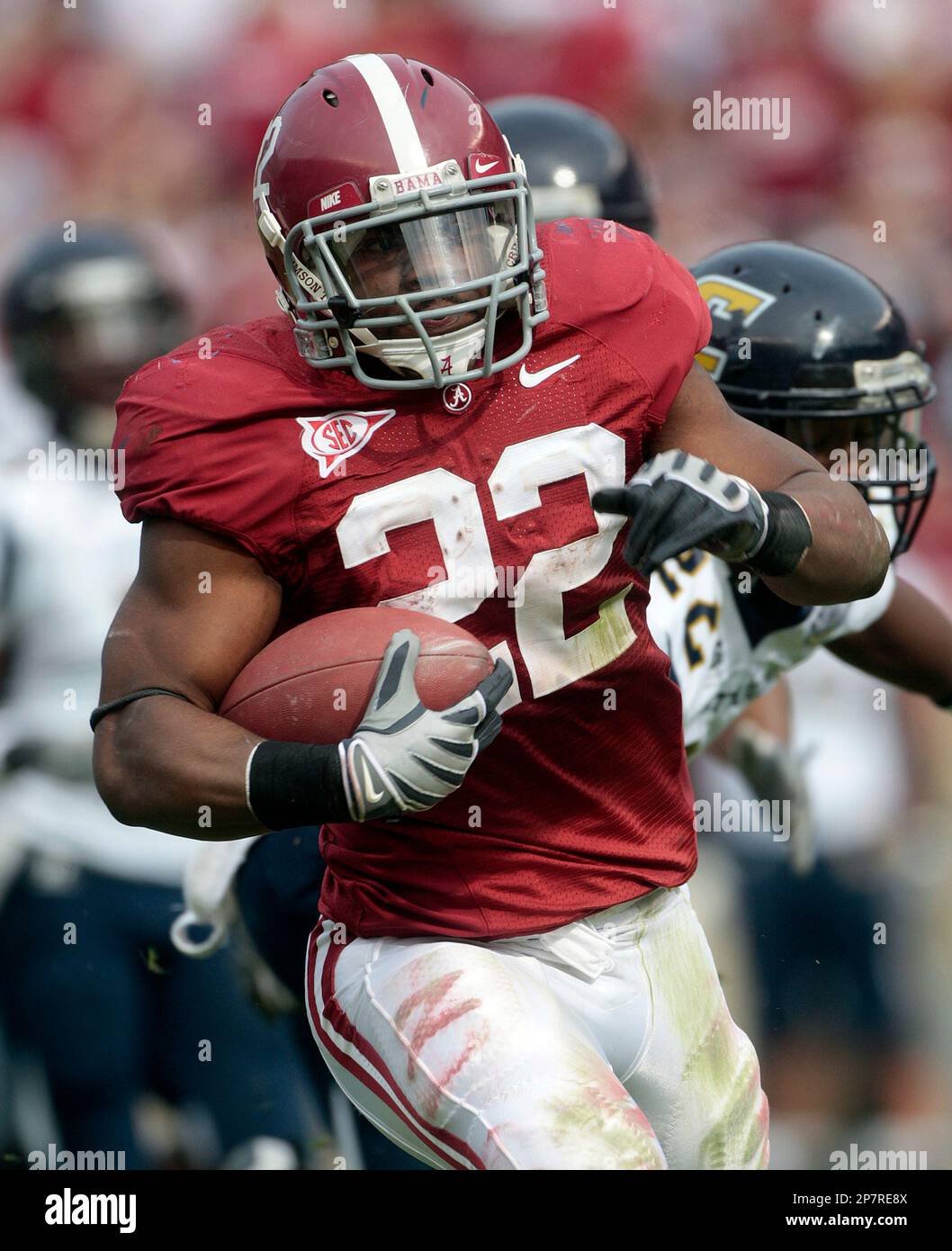 Alabama running back Mark Ingram (22) runs for a 25-yard touchdown run ...
