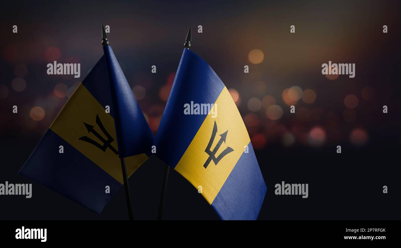 Small flags of the Barbados on an abstract blurry background Stock ...