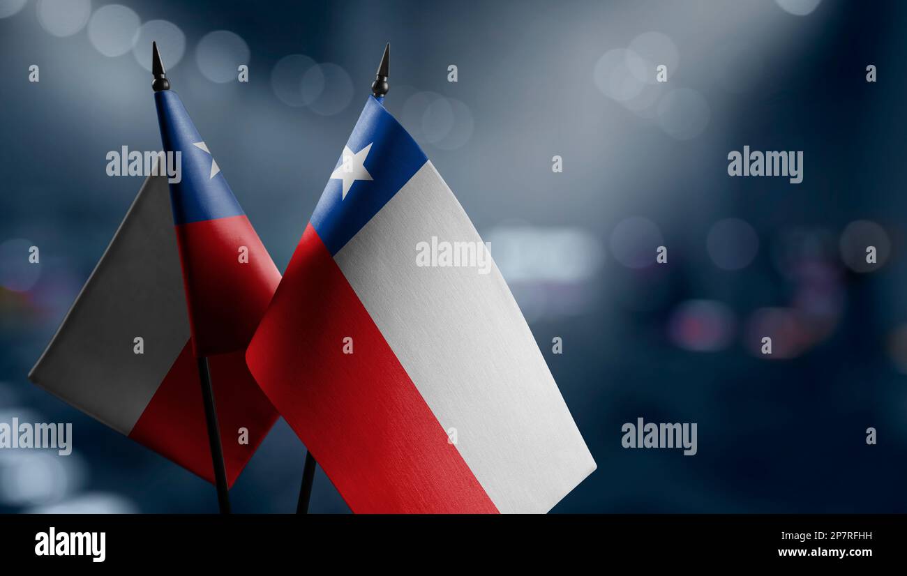 Small flags of the Chile on an abstract blurry background Stock Photo ...