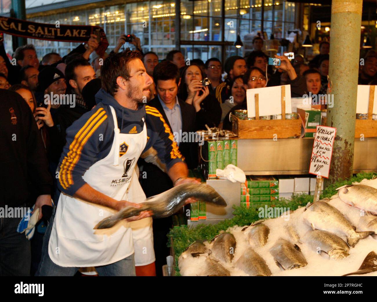 Los Angeles Galaxy's forward Alan Gordon tosses a fish at Pike Place ...