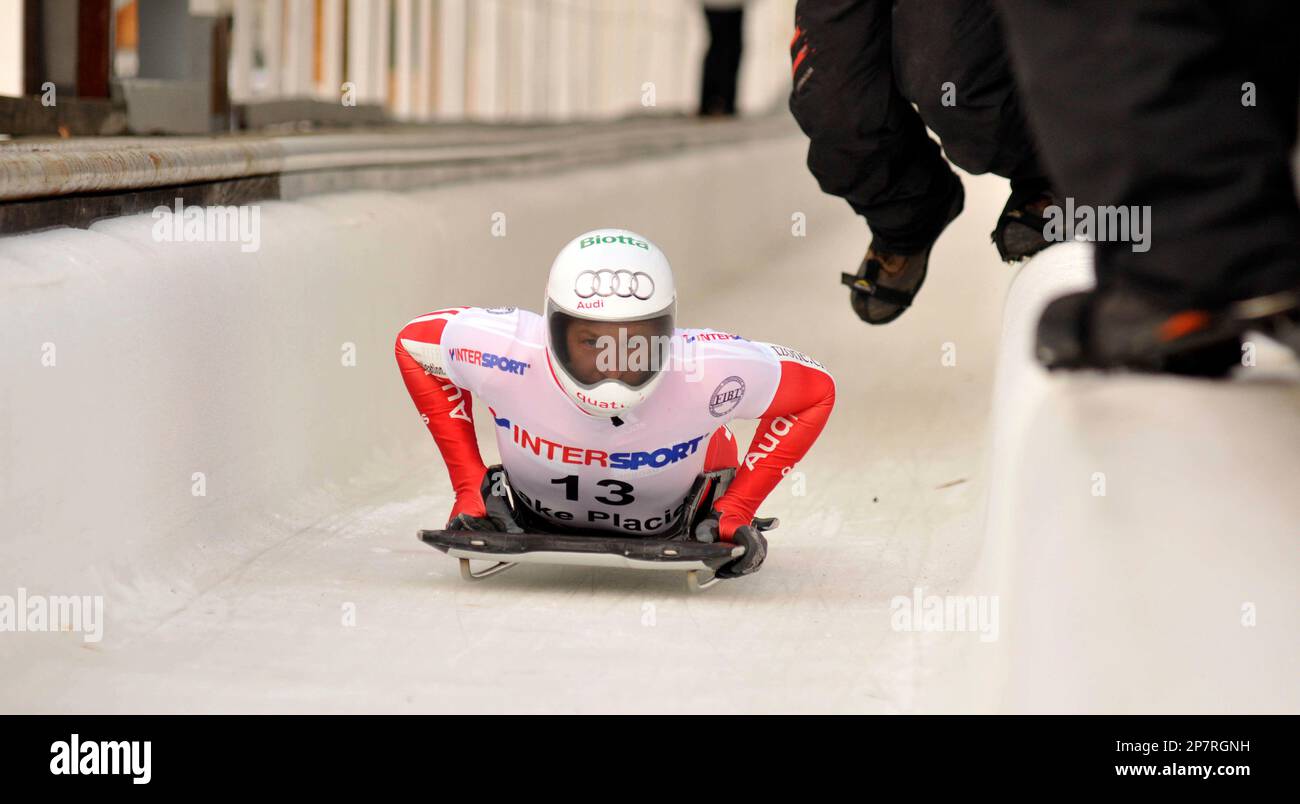 Pascal Oswald, of Switzerland, looks at the clock after his second run ...